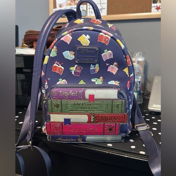 Loungefly | Bags | Loungefly Purple Backpack With Storybook Design ...